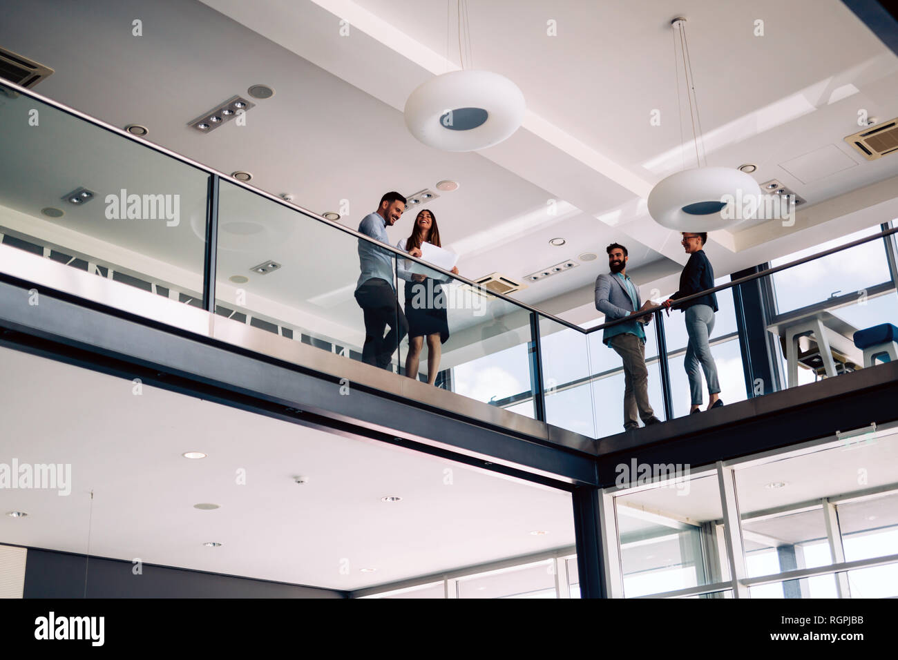 Group of architects having discussion in hall Stock Photo - Alamy