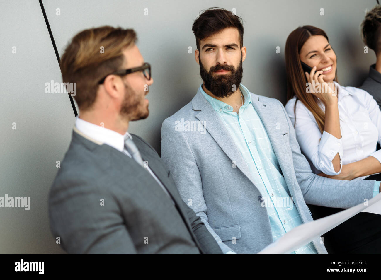 Group of perspective designers discussing in office Stock Photo - Alamy