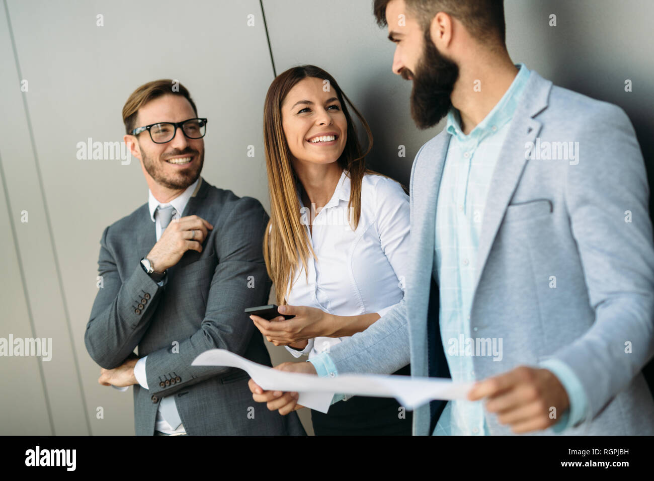 Group of perspective designers discussing in office Stock Photo - Alamy