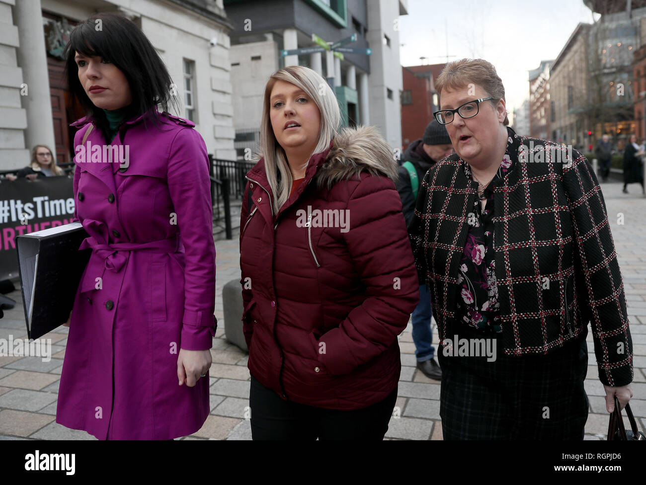 Sarah Ewart (centre) arrives with her mother Jane Christie (right) and ...