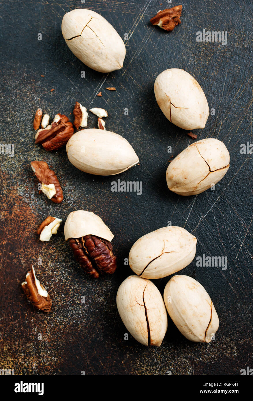 Pecan nuts on a table, pecan nuts in shell Stock Photo - Alamy