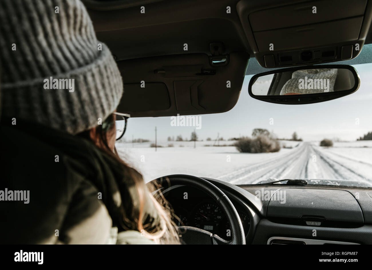 Anonymous female driving car road hi-res stock photography and images ...