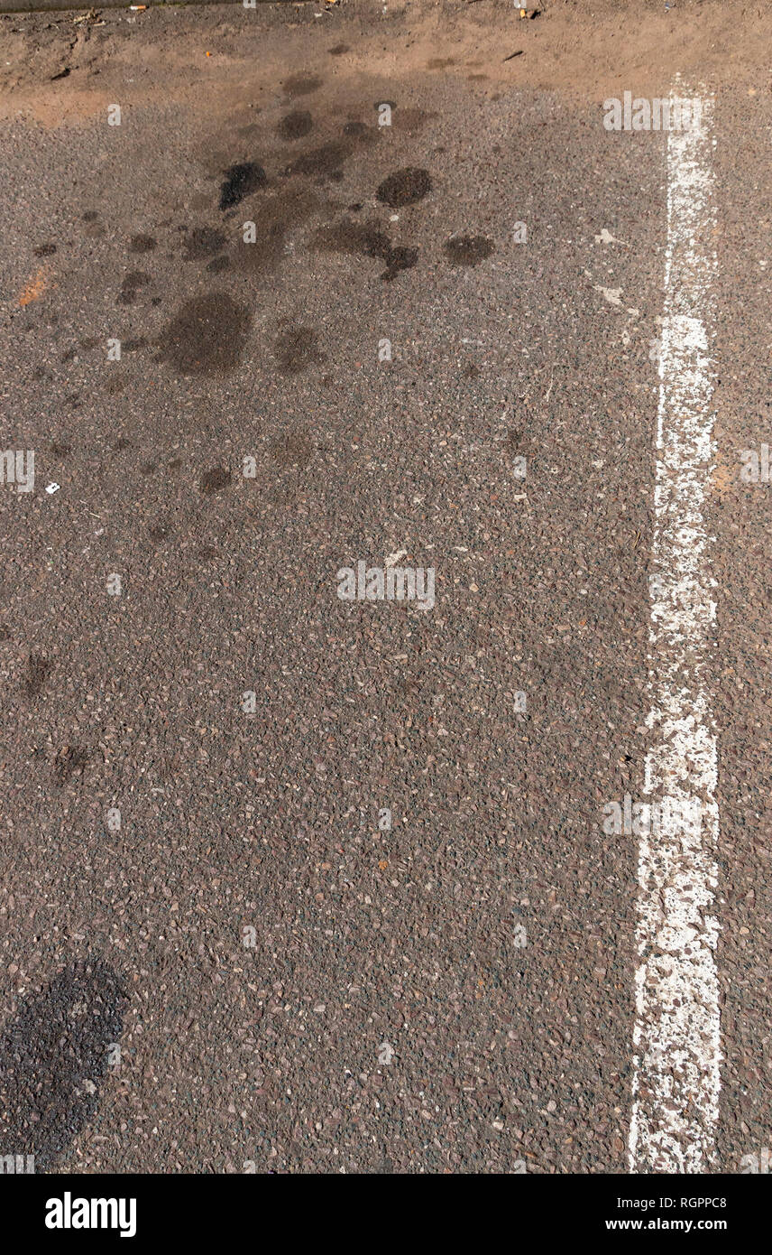 A close up view of oil stains on a tarred road Stock Photo - Alamy
