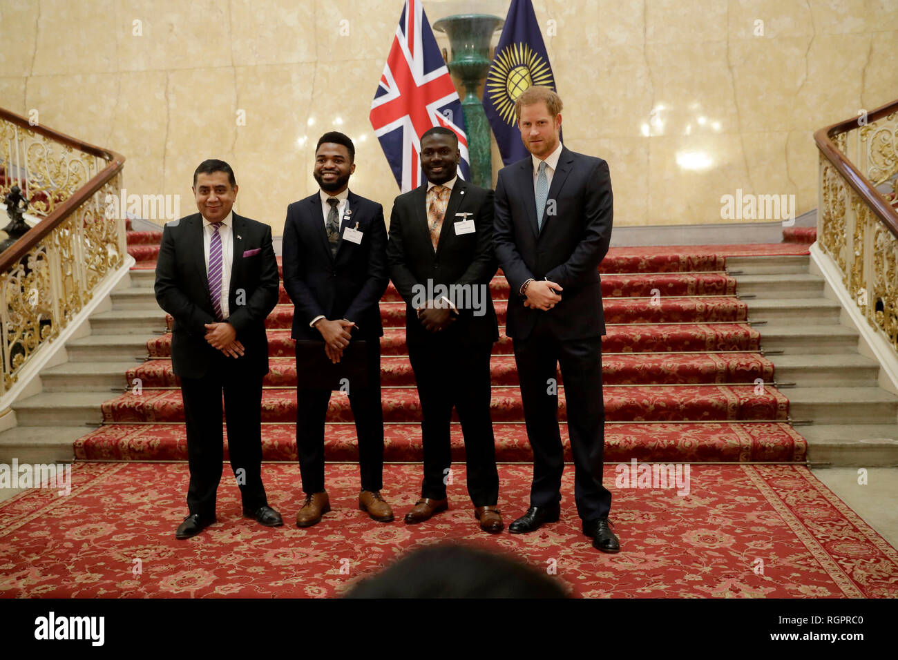 The Duke of Sussex poses for a photograph with, from left, Lord Tariq ...