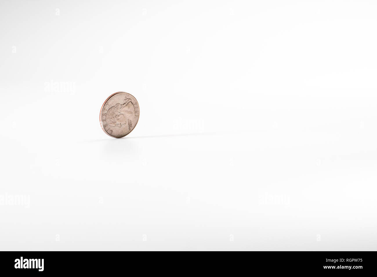 Dollar coin rotating on white background, concept of American economy ...
