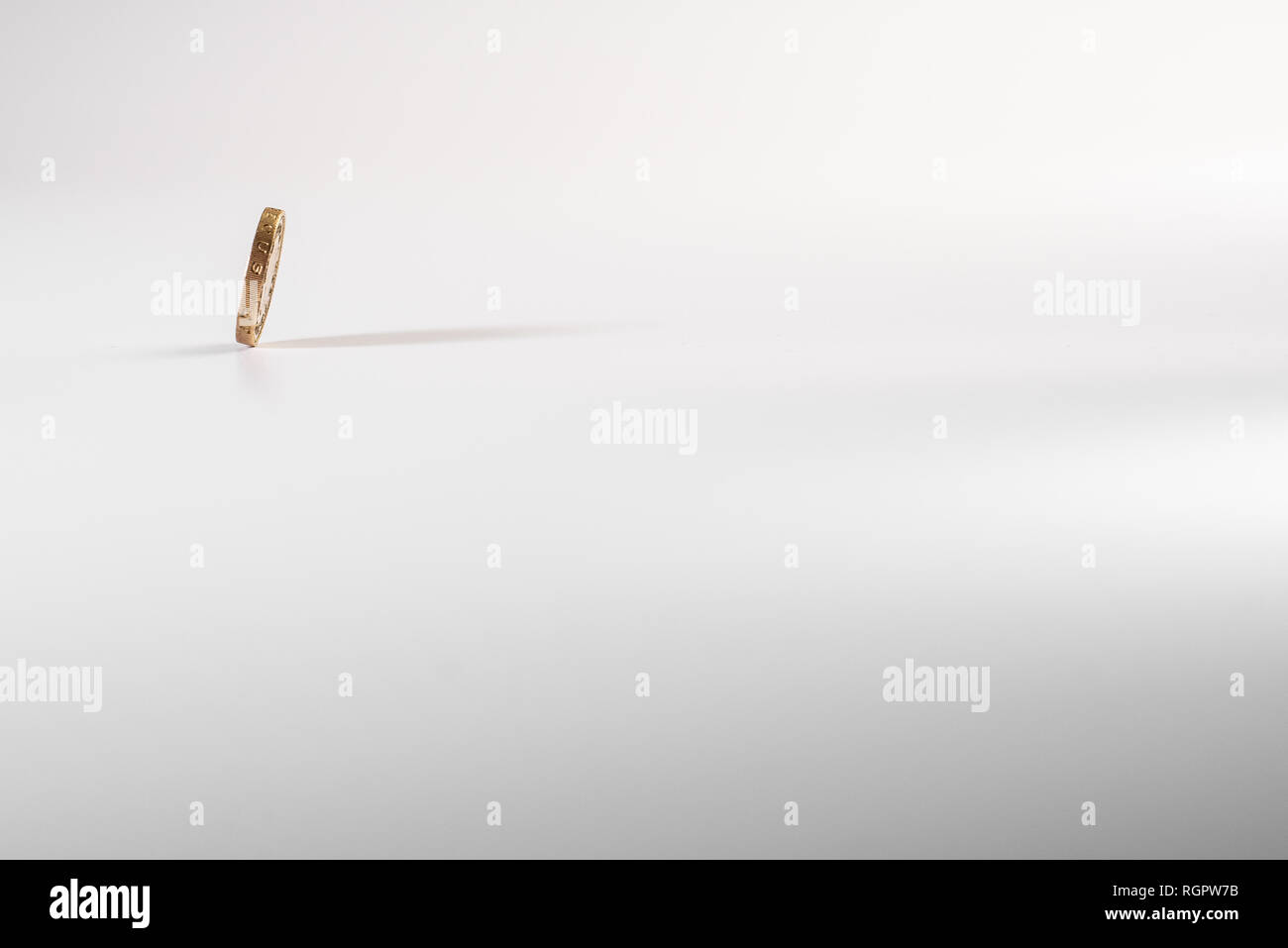 1 British pound coin falling on white background, isolated Stock Photo ...