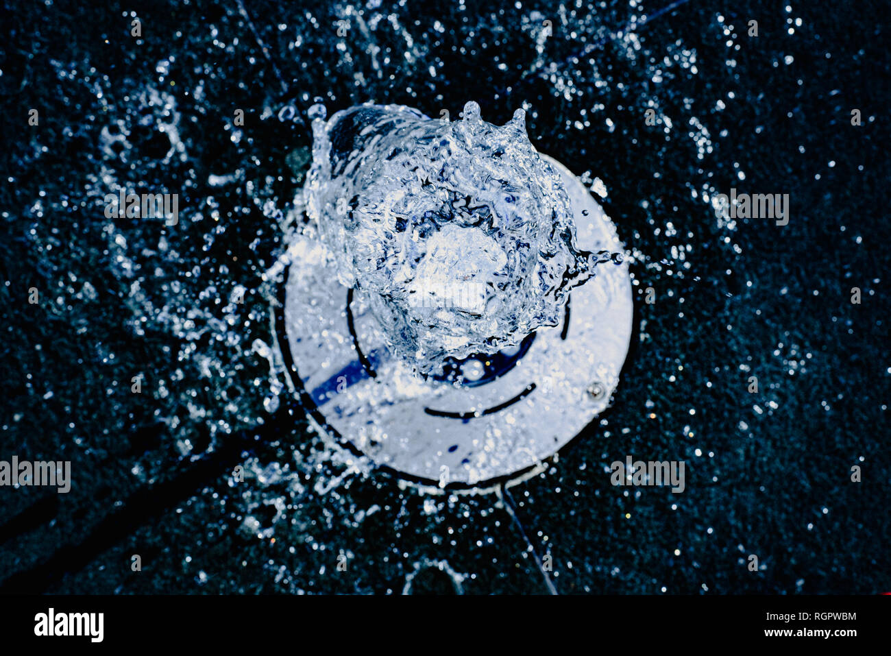 Water jet going up towards the camera, blue tones, background for ...