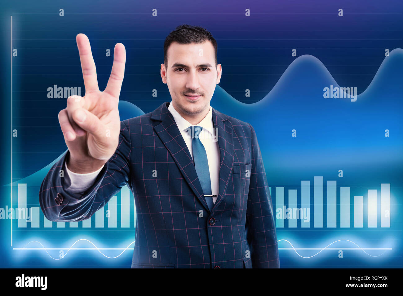 Businessman showing victory sign with index and middle fingers as ...