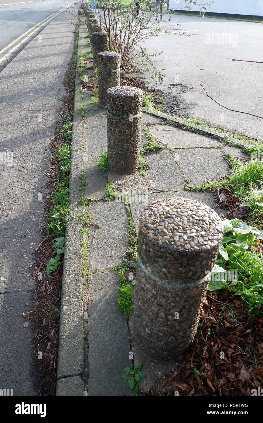 Row of mini street pillars car park Stock Photo - Alamy