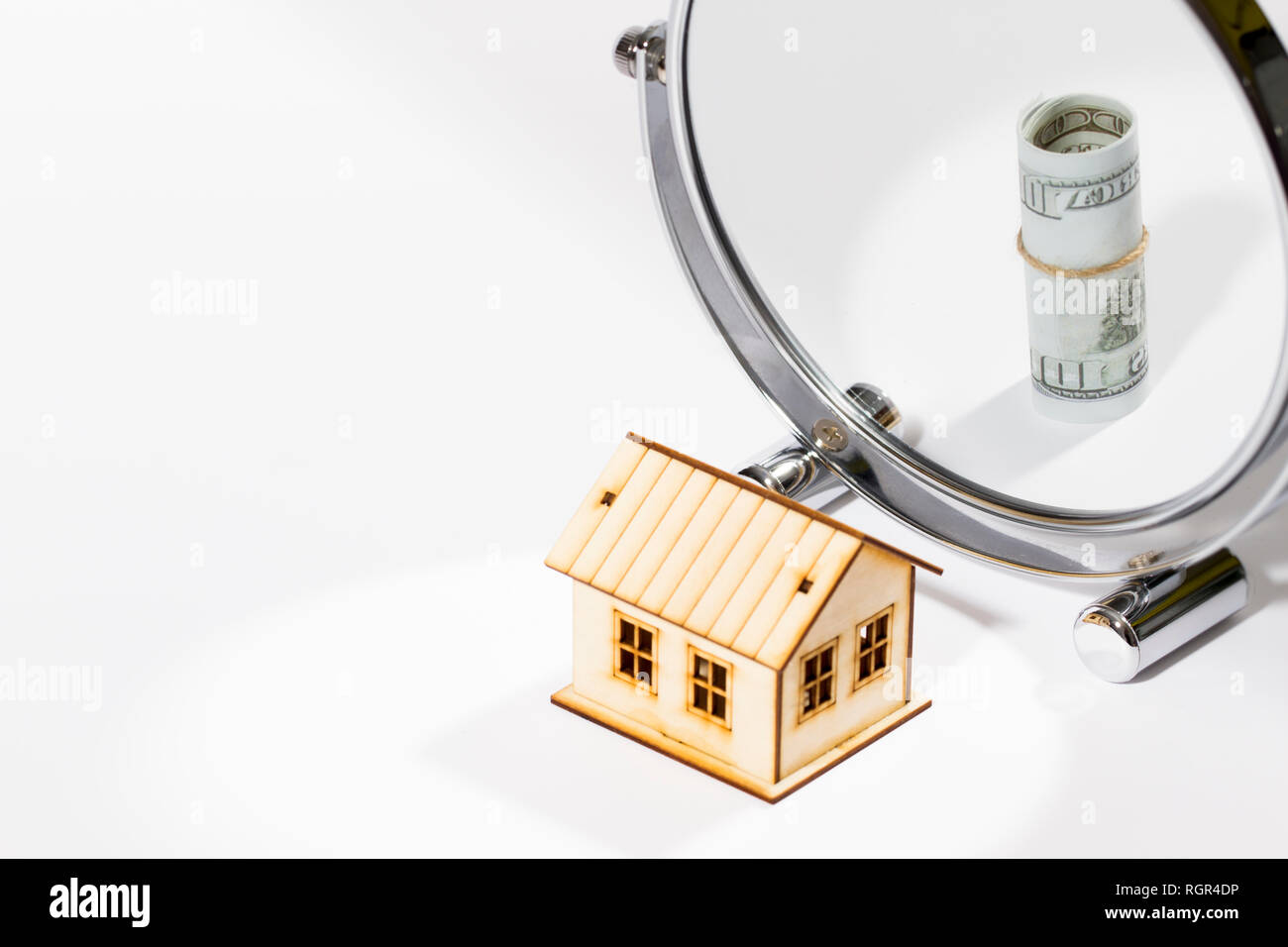 Money in the mirror and realistic house, wishes and goals Stock Photo ...