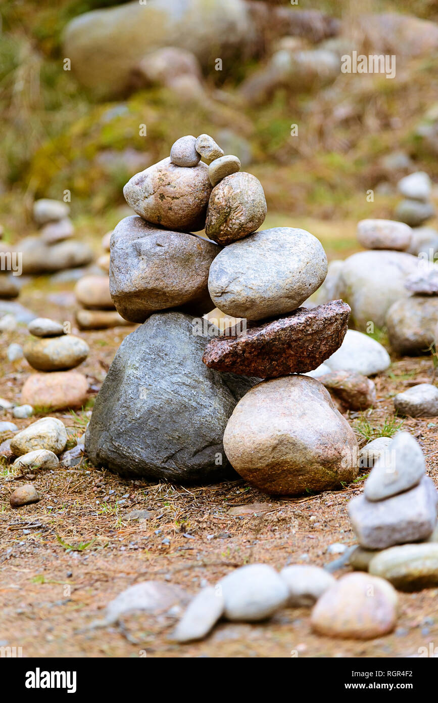 stones folded in a hill lean on each other Stock Photo - Alamy