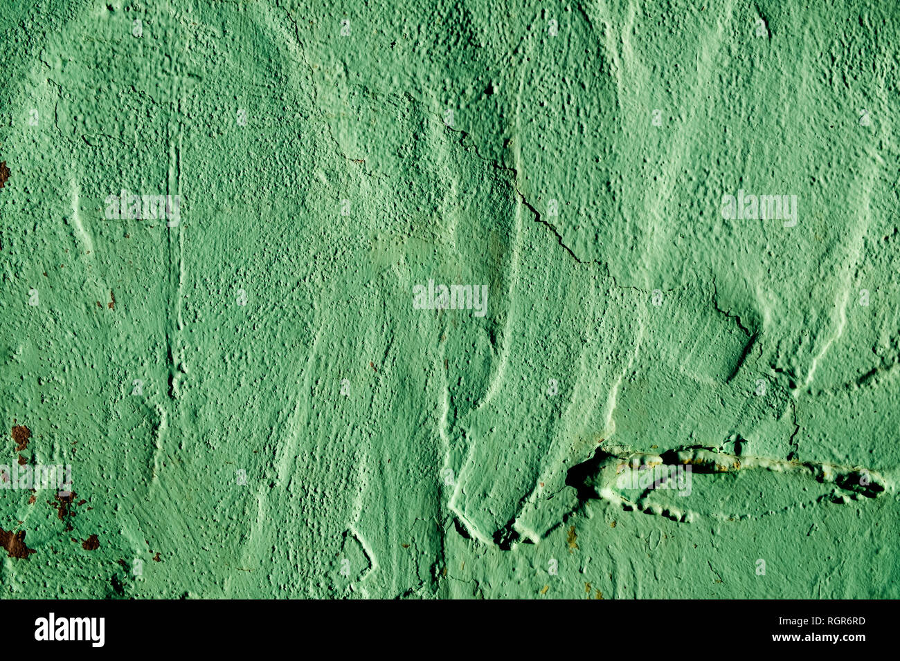 closeup of a rustic green plastered wall to be used as a background ...