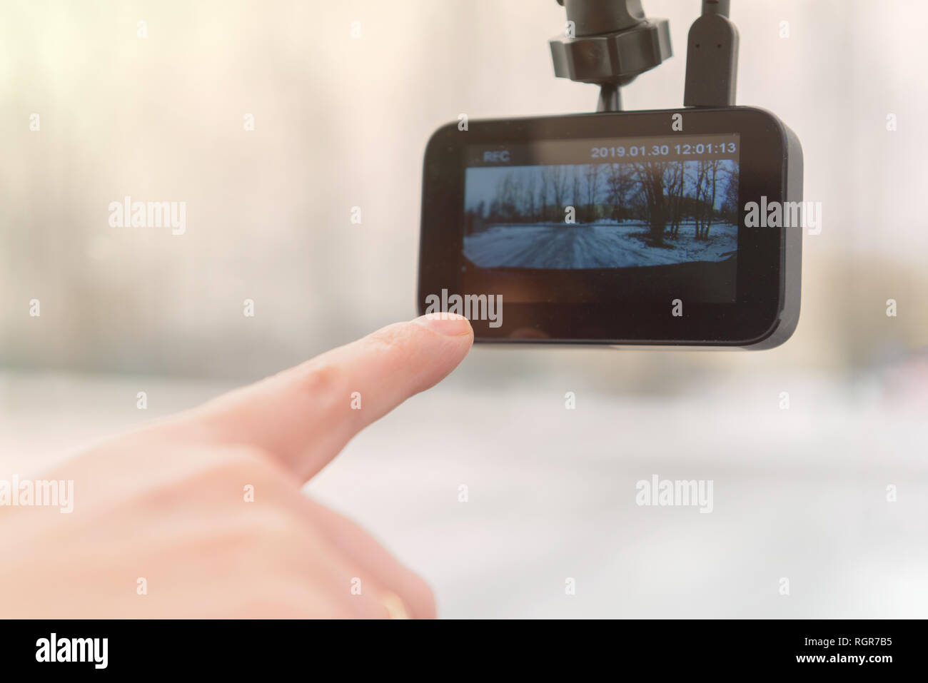 Using dashboard camera to continuously record a view through a vehicle ...