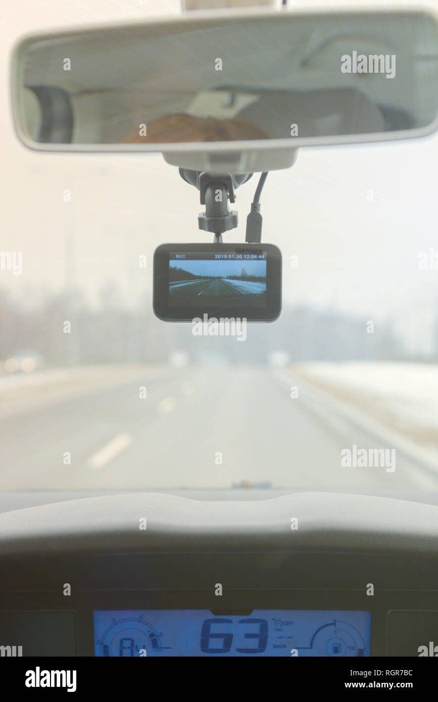 Using dashboard camera to continuously record a view through a vehicle ...