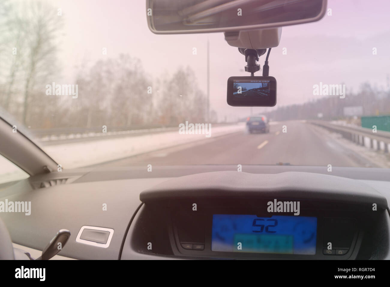 Using dashboard camera to continuously record a view through a vehicle ...