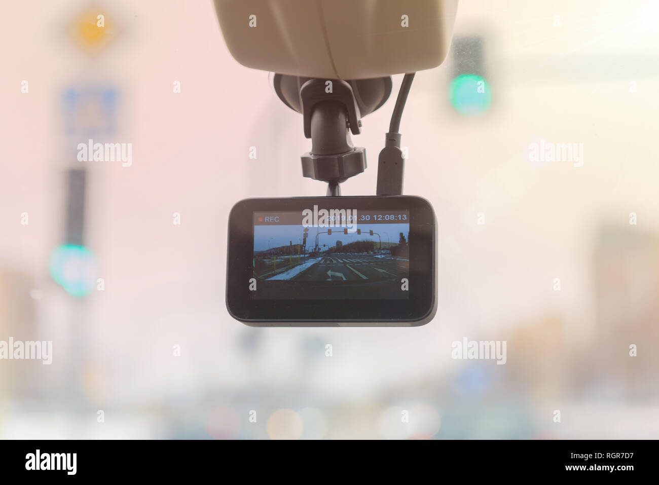 Using dashboard camera to continuously record a view through a vehicle ...