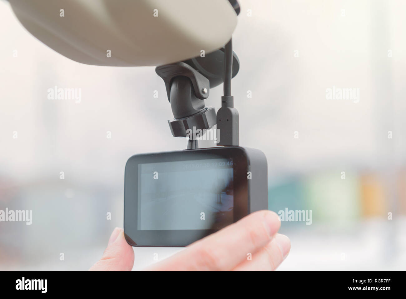 Using dashboard camera to continuously record a view through a vehicle ...