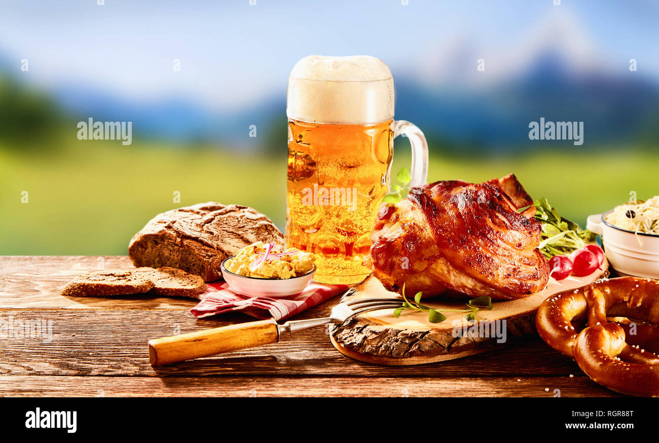 Traditional German cuisine, Schweinshaxe roasted ham hock, pretzel with ...