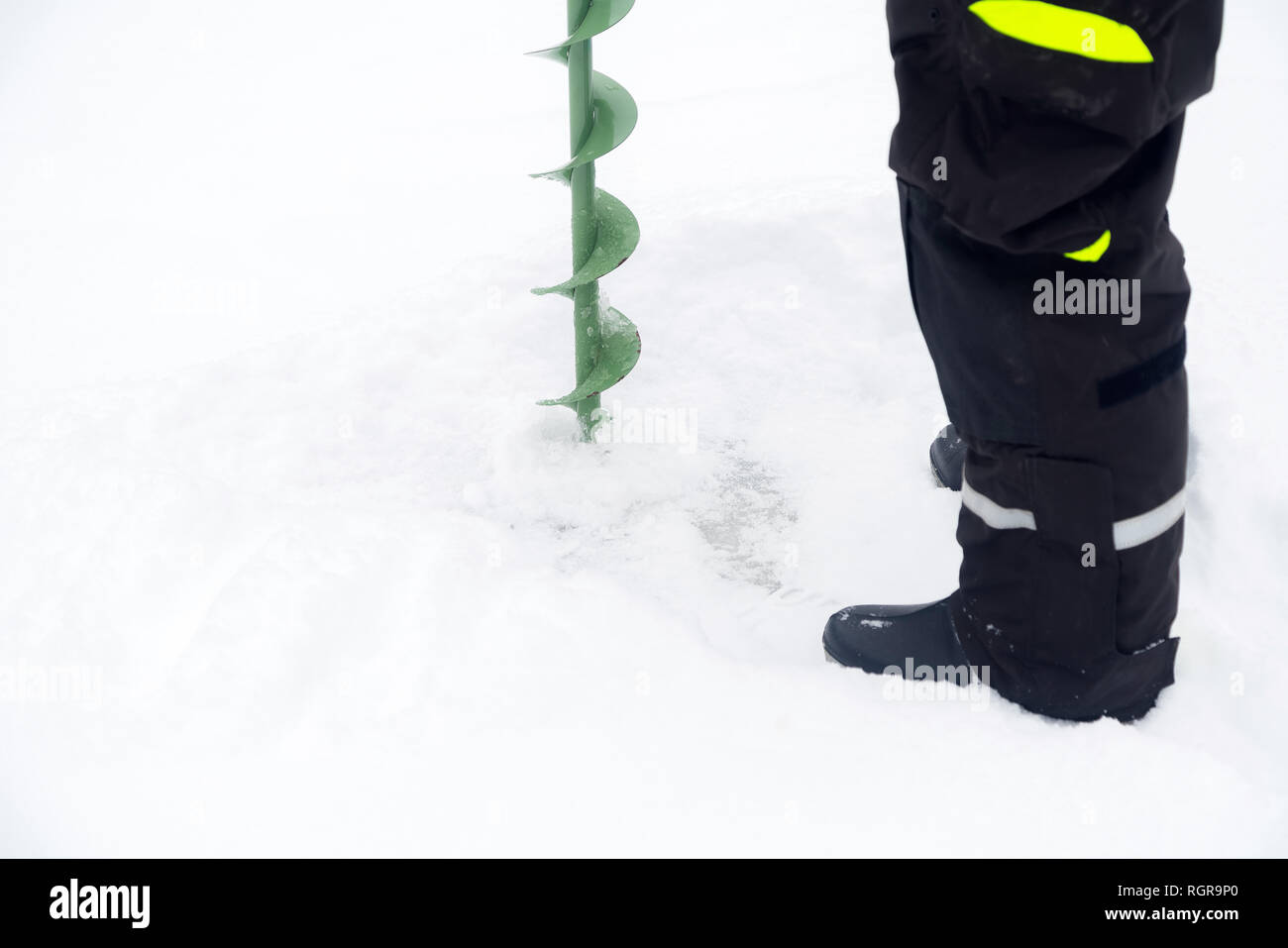 Drilling a hole in the ice hi-res stock photography and images - Alamy