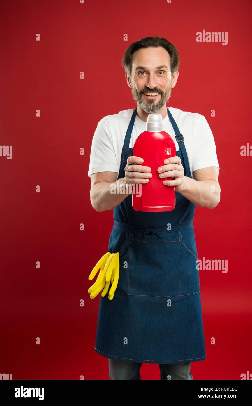 Cleaning service and household duty. Man in apron with gloves hold ...