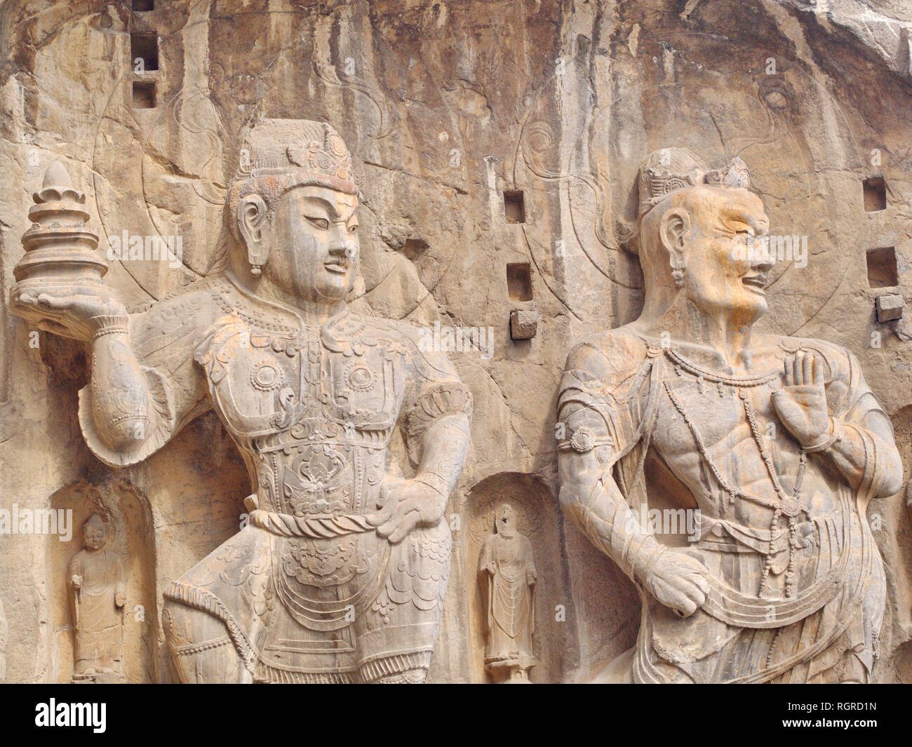 Luoyang Longmen grottoes. Broken Buddha and the stone caves and ...