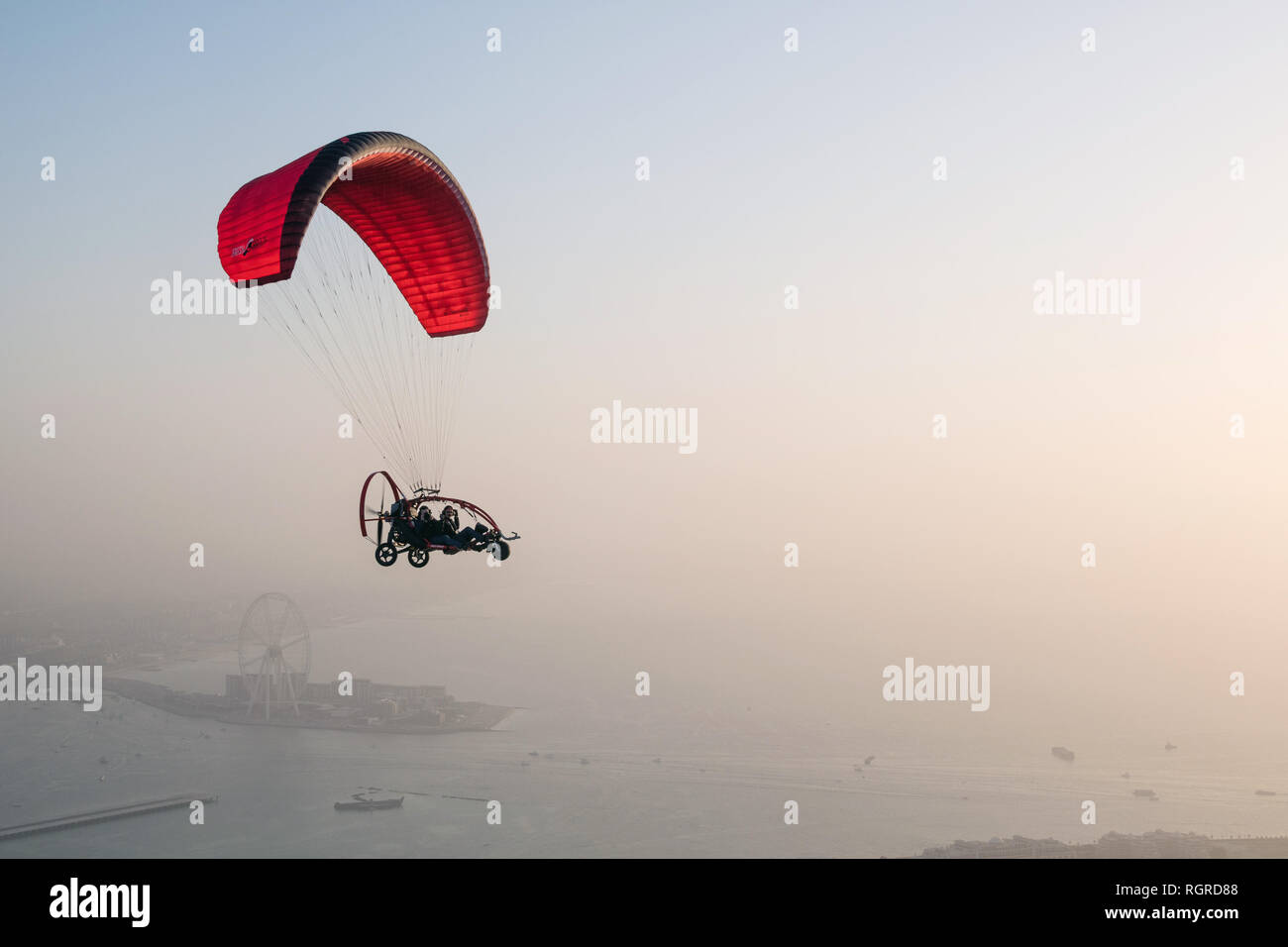 DUBAI, UAE - February 16, 2018: SkyHub Paramotor tandem flight from ...