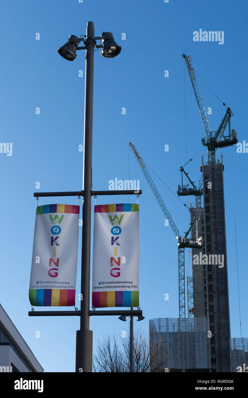 Celebrate Woking on flags in Woking town centre with a high rise ...