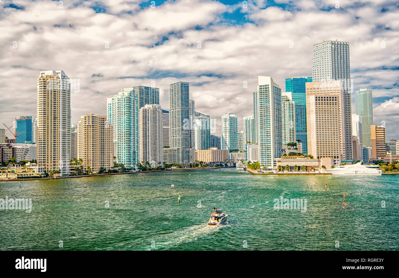 miami city skyline. Yachts sail on sea or ocean water to city ...