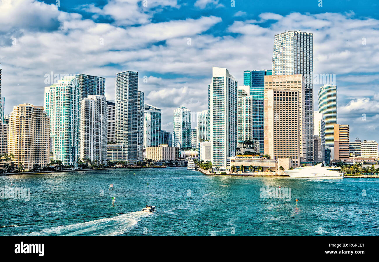miami skyline. Yachts sail on sea water to city skyscrapers on cloudy ...