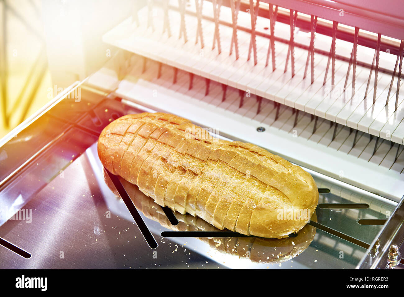 Sliced white bread in a cutting machine Stock Photo - Alamy