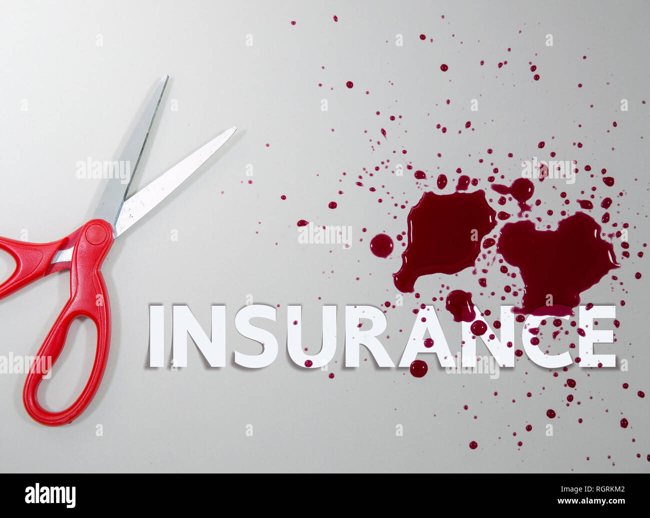 scissor with injured blood and insurance wording Stock Photo - Alamy