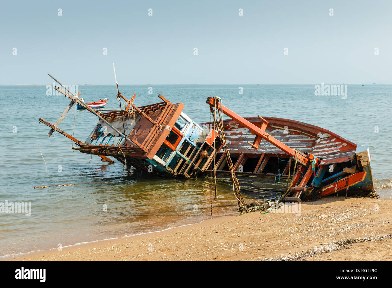 old shipwreck or abandoned shipwreck, broken fishing ship lies on its ...