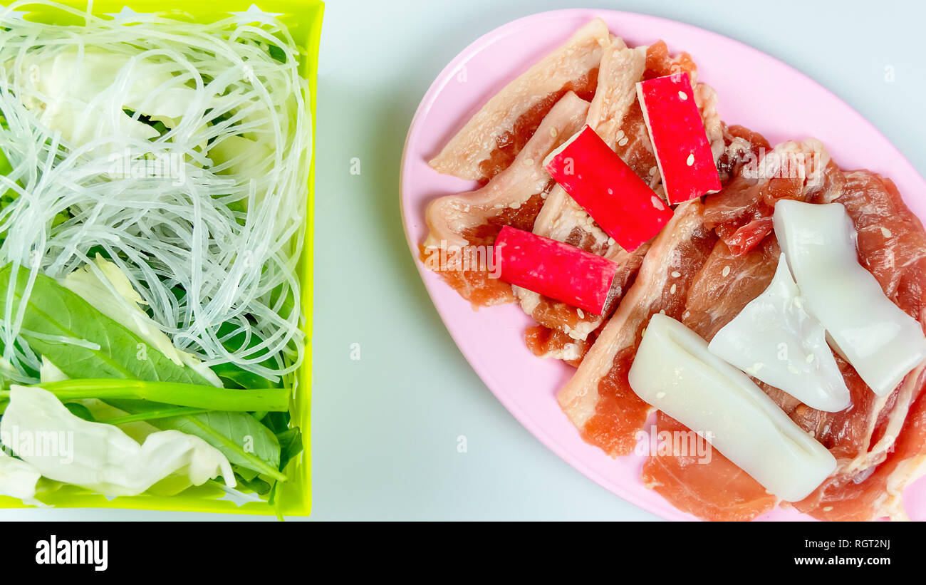 top view raw pork on plate isolated on white background Stock Photo - Alamy