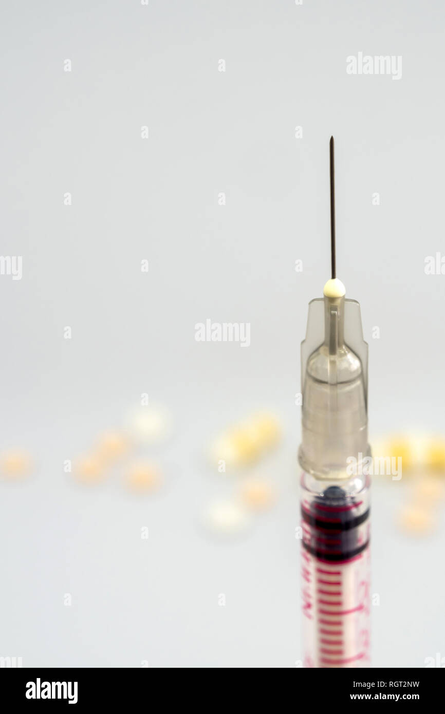 Syringe, injection needle and some pill on white background Stock Photo ...