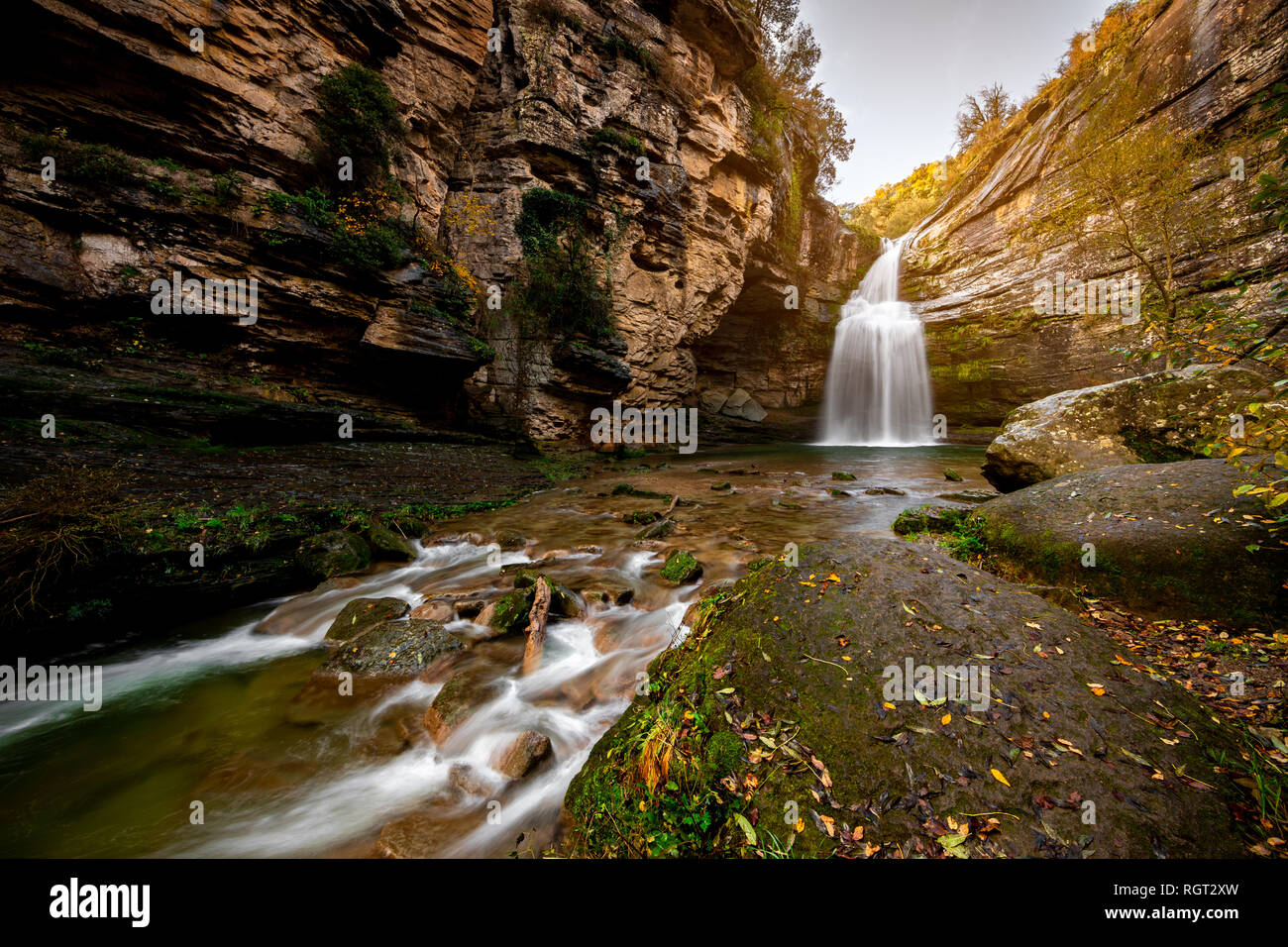 Waterfall in the middle of the mountain Stock Photo - Alamy