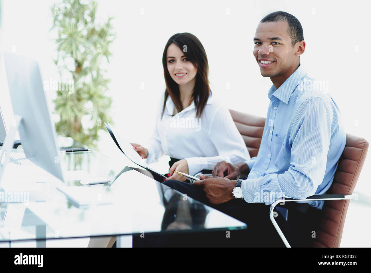 two successful employee in the workplace in the office Stock Photo - Alamy