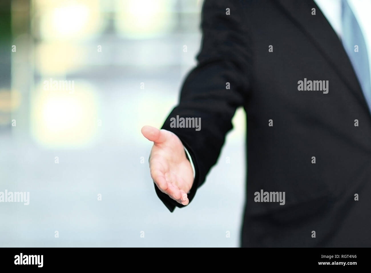Man holding out hand shake hi-res stock photography and images - Alamy