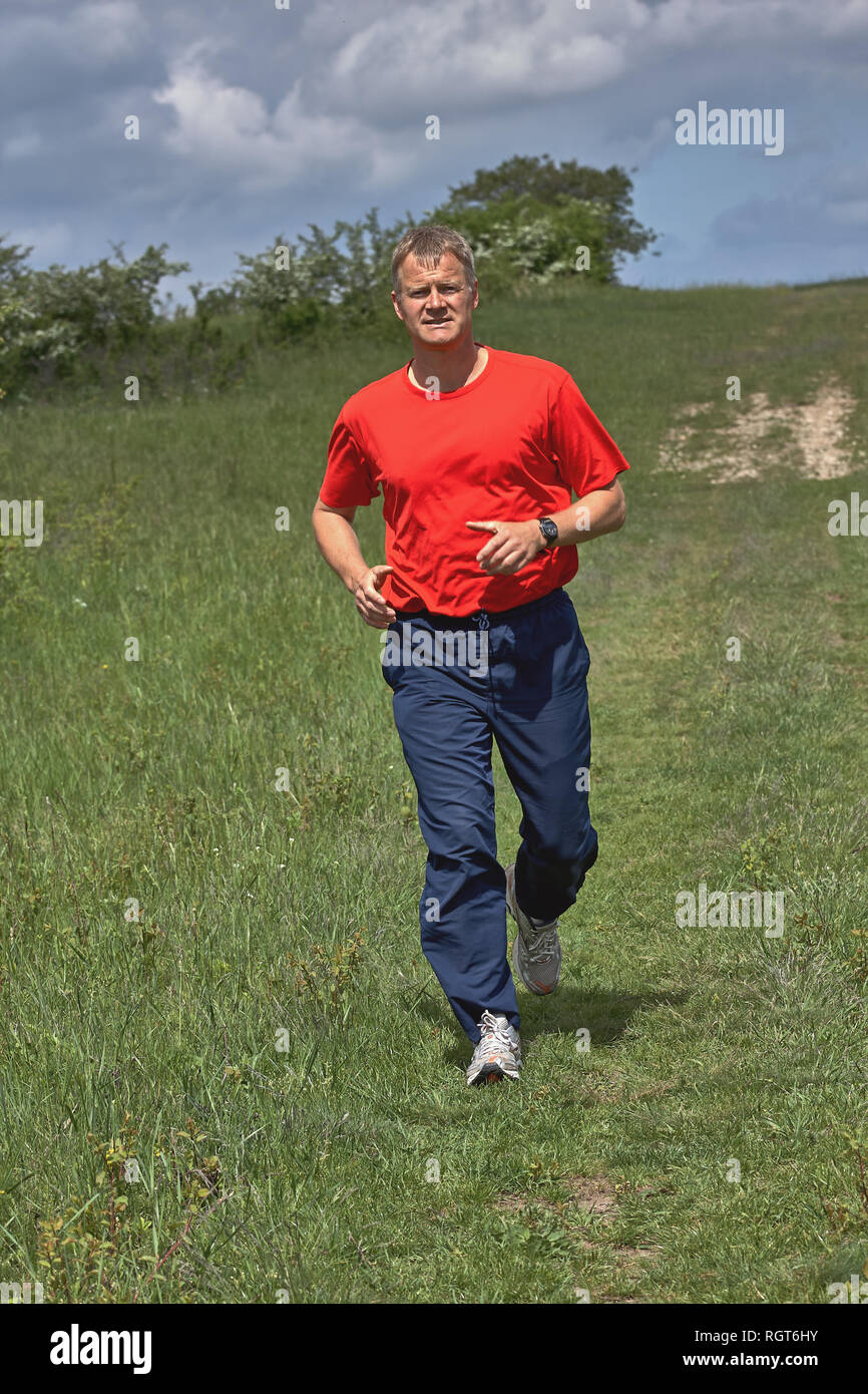 Runner in red t shirt hi-res stock photography and images - Alamy