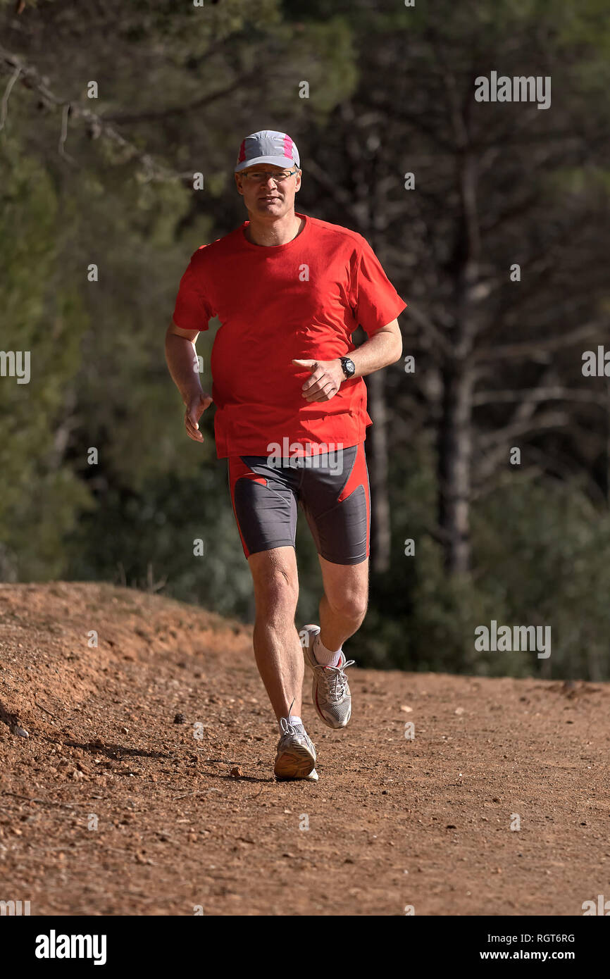 Runner in red t shirt hi-res stock photography and images - Alamy