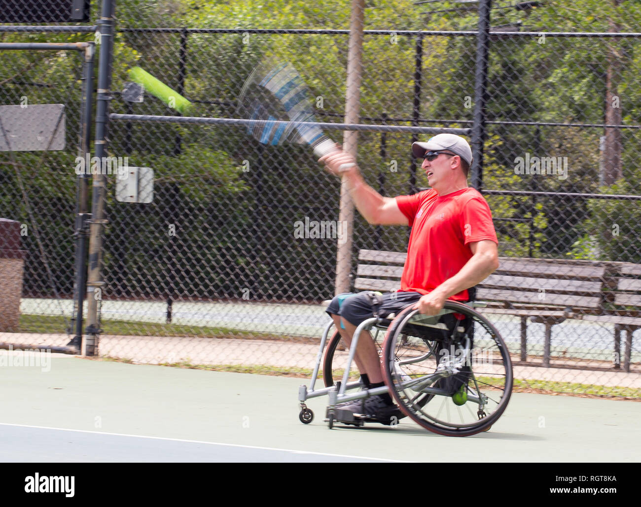 A wheelchair athlete playing tennis as part of the Adaptive Sports ...