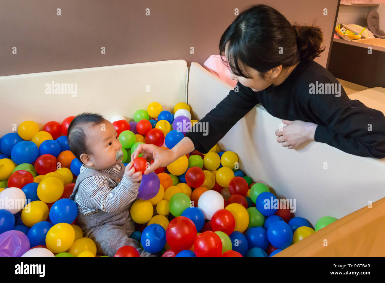Baby Playing In Ball Pit High Resolution Stock Photography and Images ...