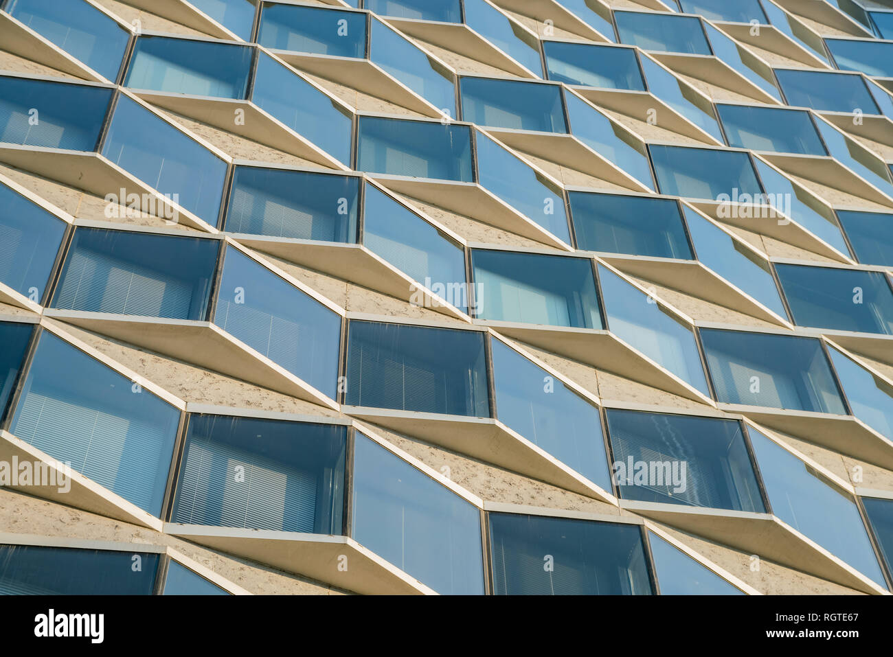 Close up shot of a building with full of interesting shape window at ...