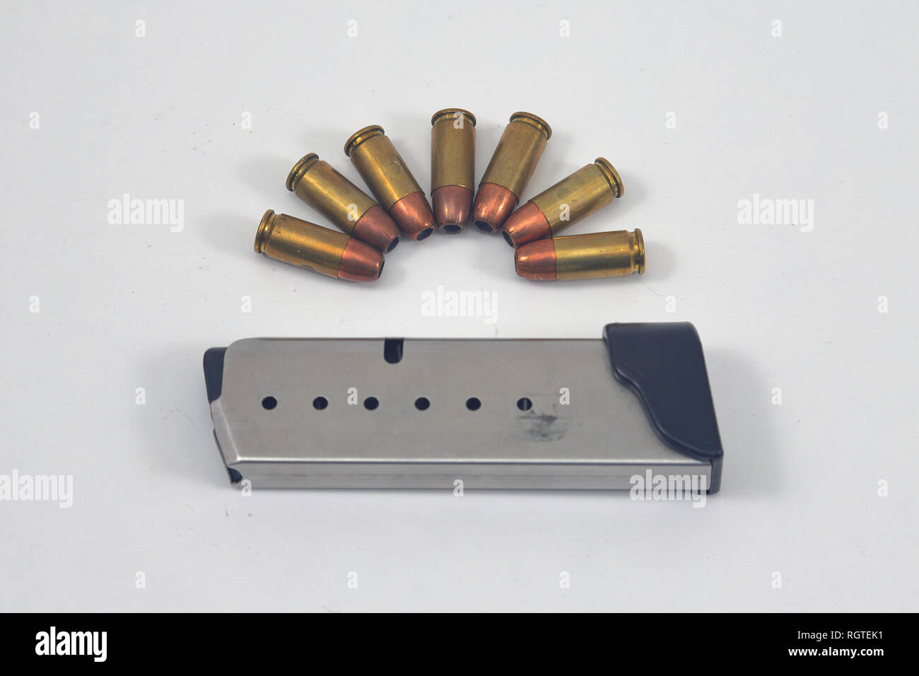 Pistol ammunition and magazine on white background. Used with semi ...