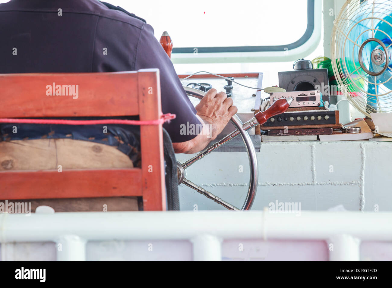 Man wheel boat helm in hi-res stock photography and images - Alamy