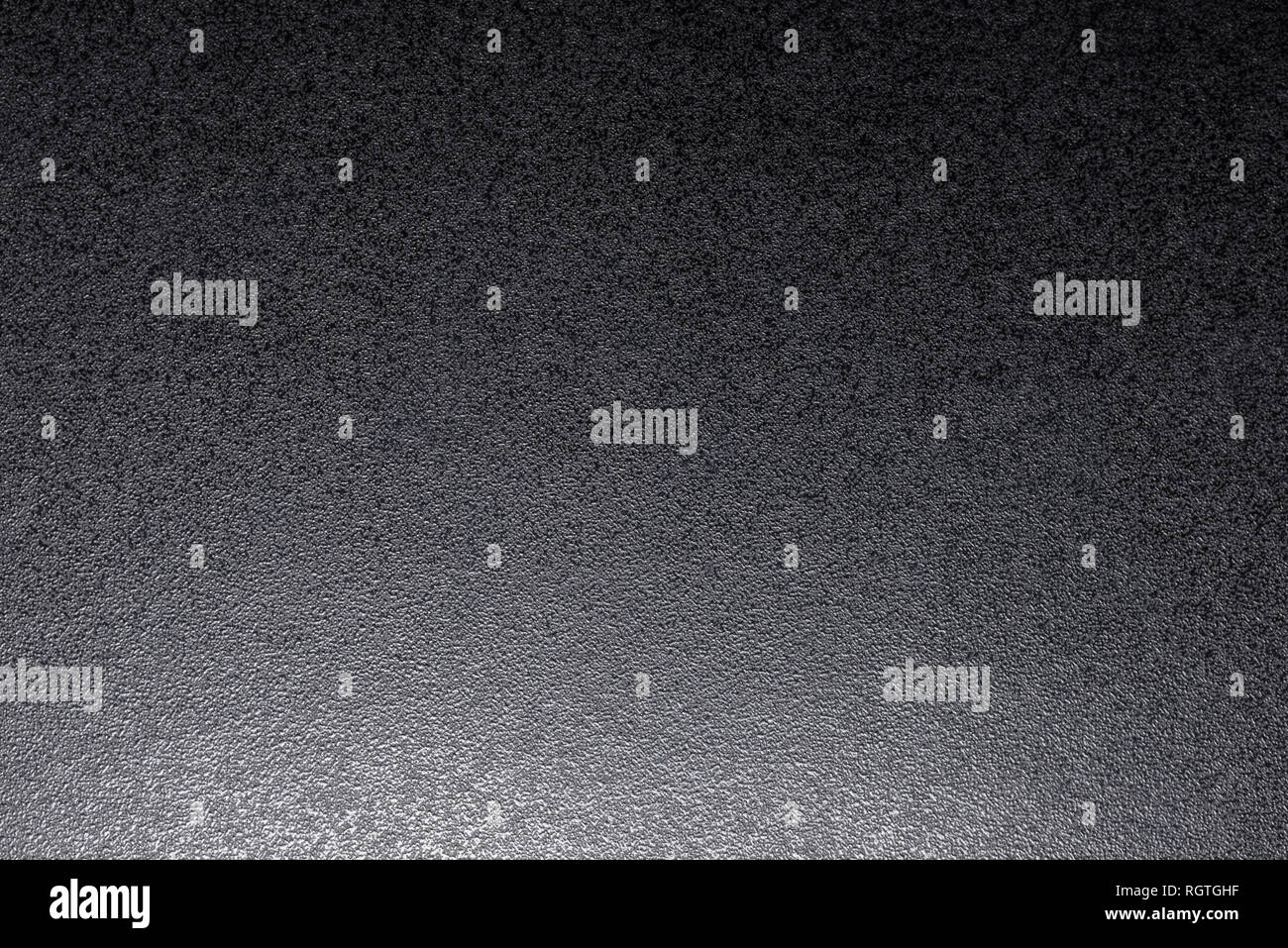 Closeup of black, rough background lit with dim light Stock Photo - Alamy