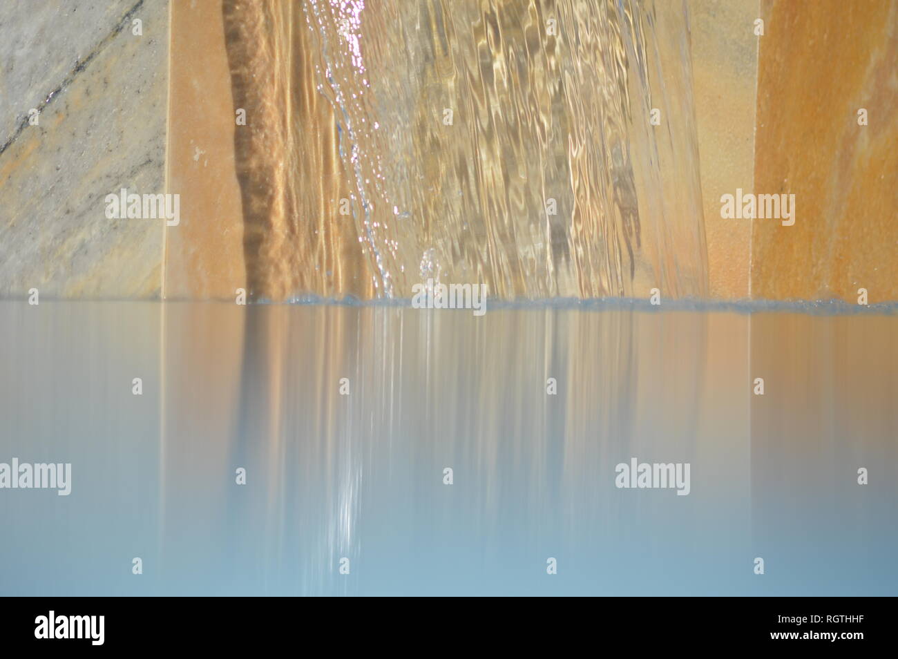 Zoom on a small waterfall from a Swimming pool Stock Photo - Alamy