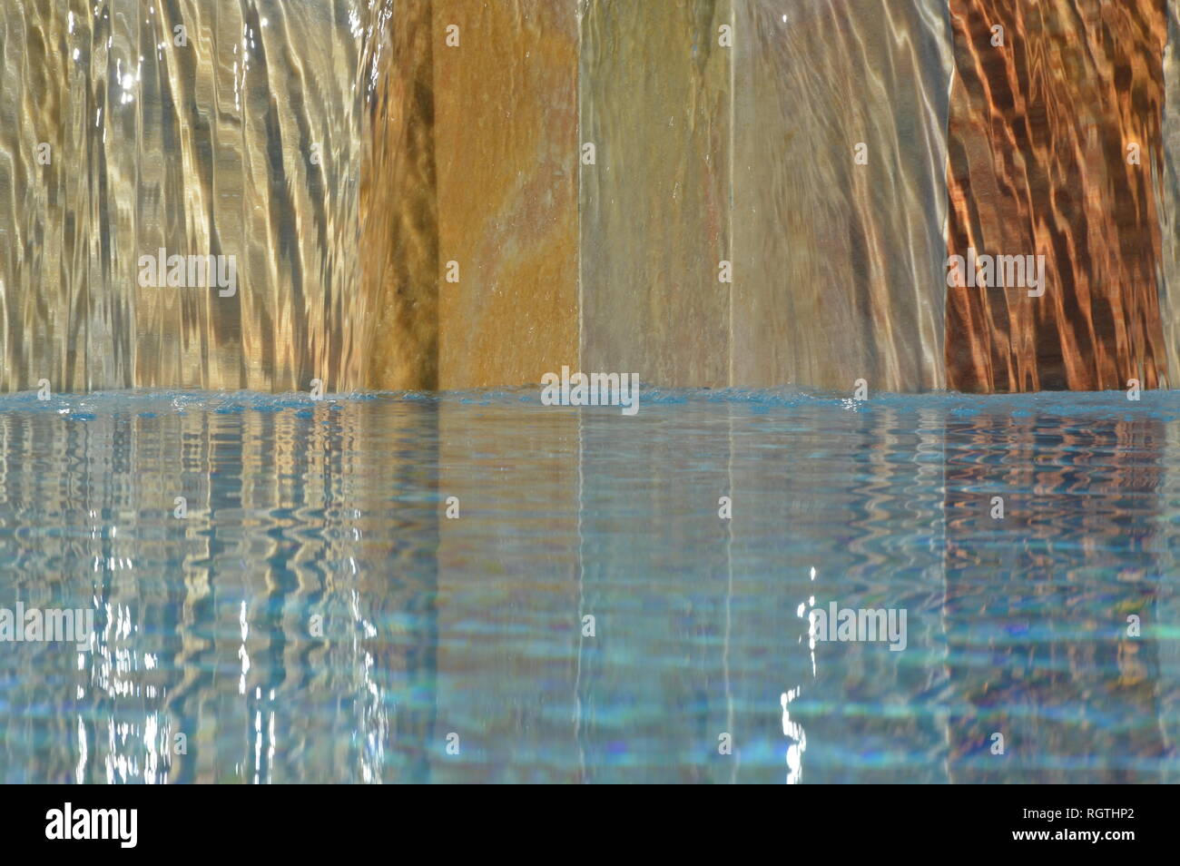 Zoom on a small waterfall from a Swimming pool Stock Photo - Alamy