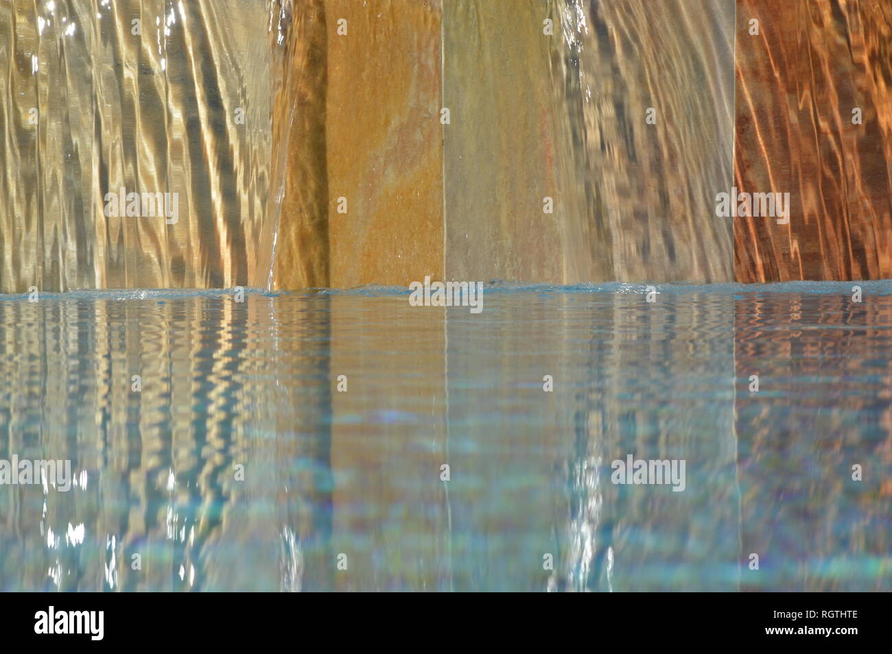 Zoom on a small waterfall from a Swimming pool Stock Photo - Alamy