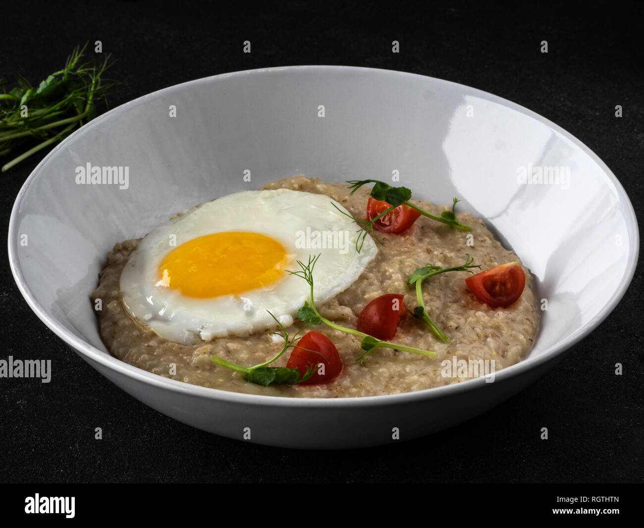 Parmesan Oatmeal and Scrambled Eggs Stock Photo - Alamy