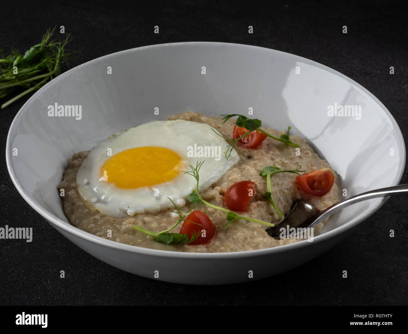 Parmesan Oatmeal and Scrambled Eggs Stock Photo - Alamy